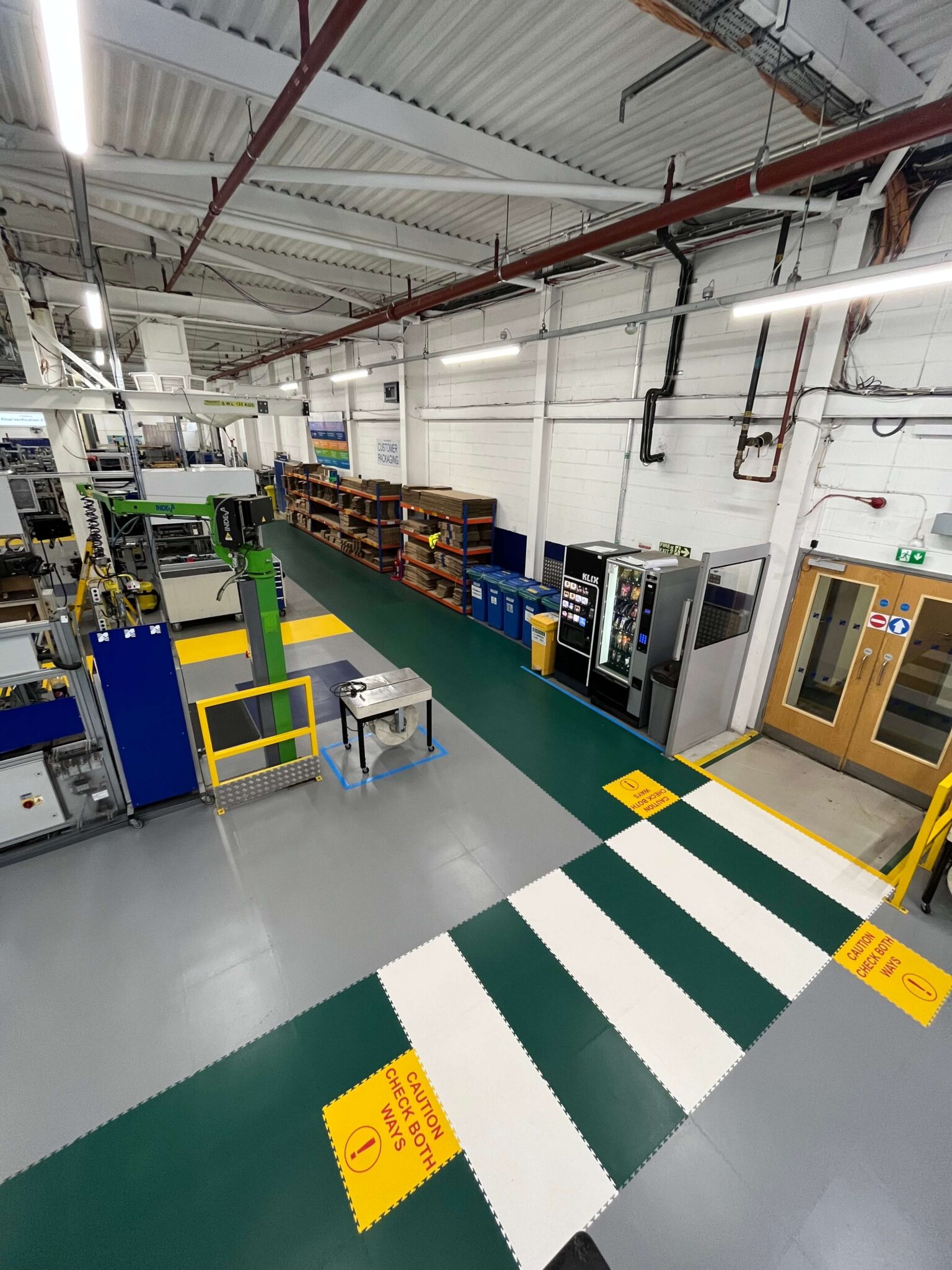 Safety floor layouts and messages using interlocking floor tiles